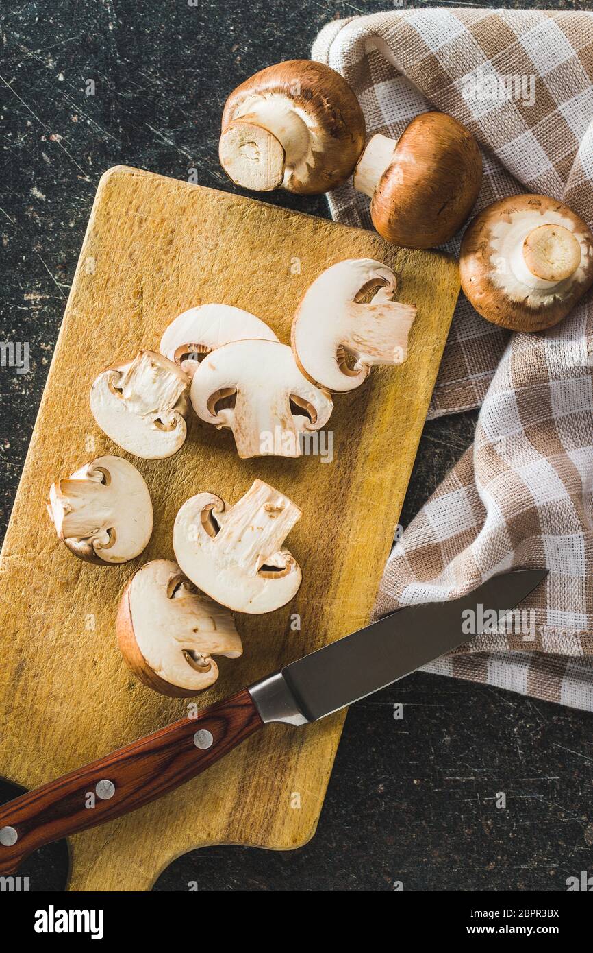 Fresh sliced champignon mushrooms on cutting board Stock Photo - Alamy