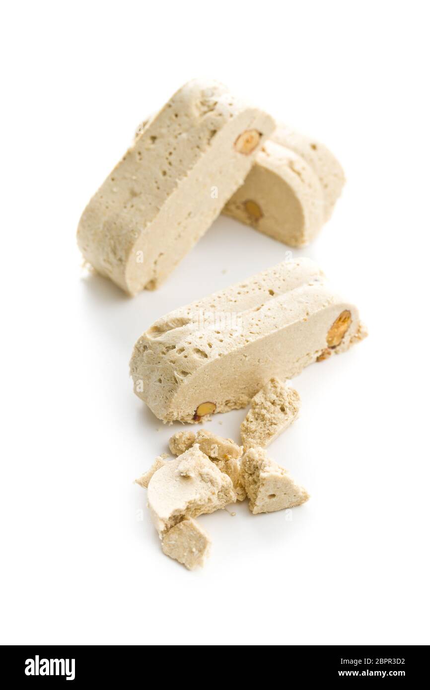 Sweet halva dessert slices with almonds isolated on white background ...