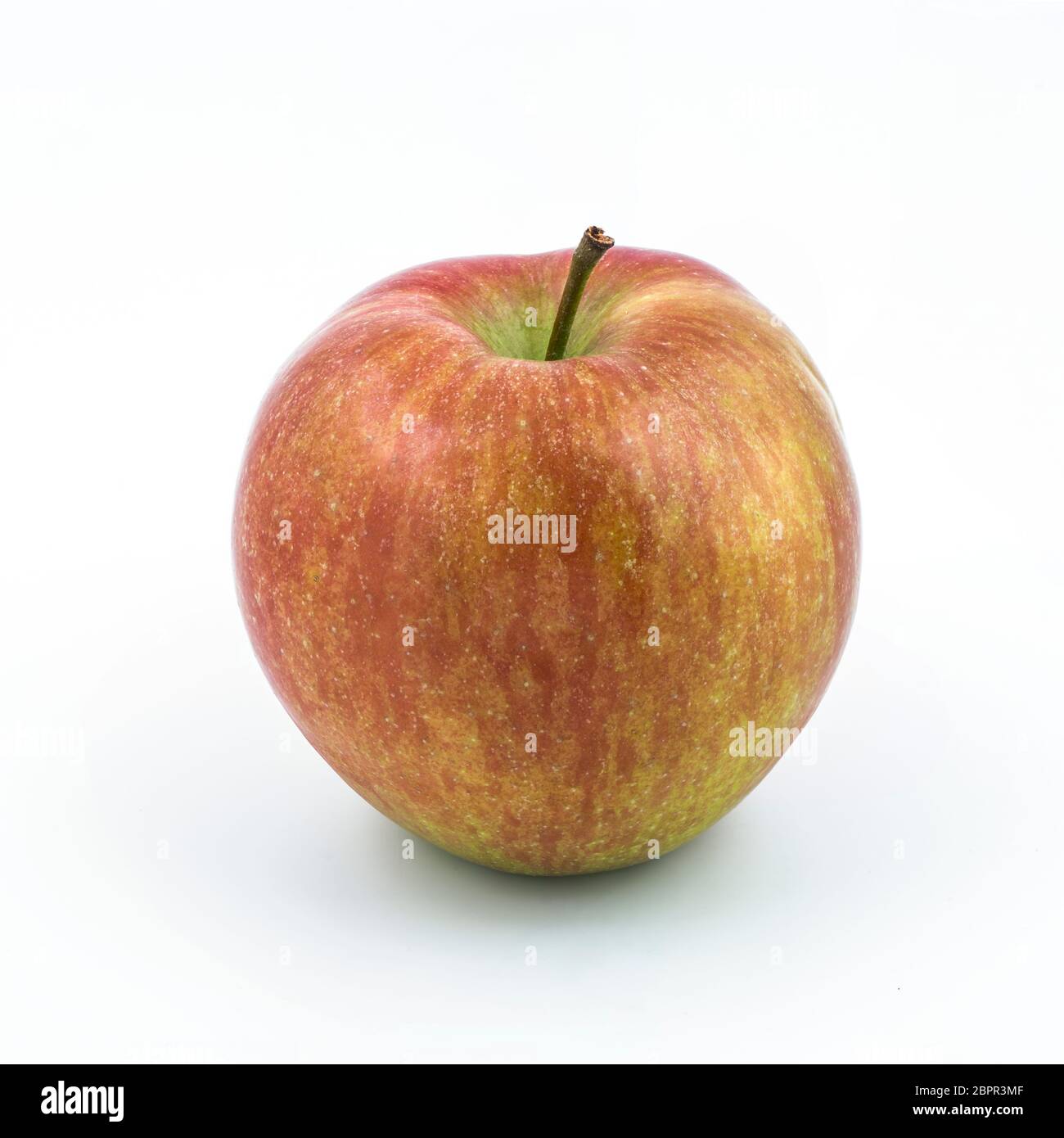 a red apple isolated on a white surface Stock Photo - Alamy