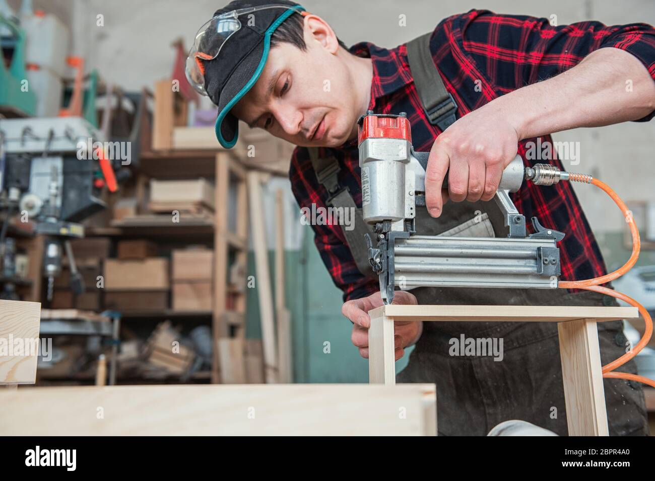 Worker making the wood box. Profession, carpentry and woodwork concept ...