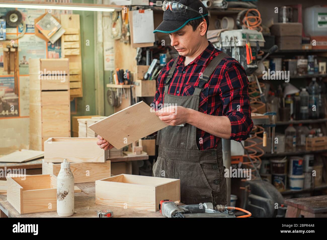 Worker making the wooden box. Profession, carpentry and woodwork ...