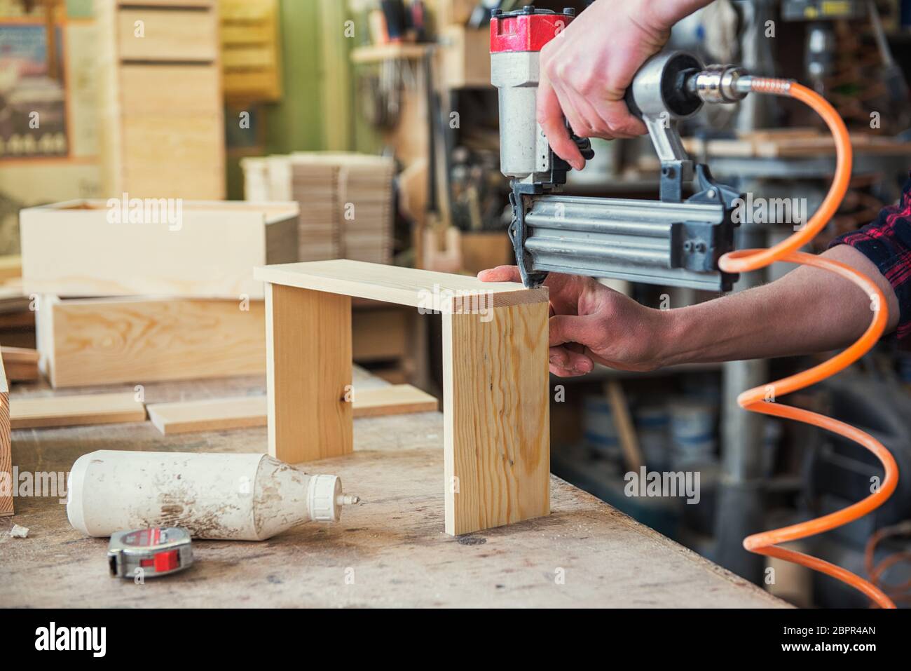 Worker making the wood box. Profession, carpentry and woodwork concept ...