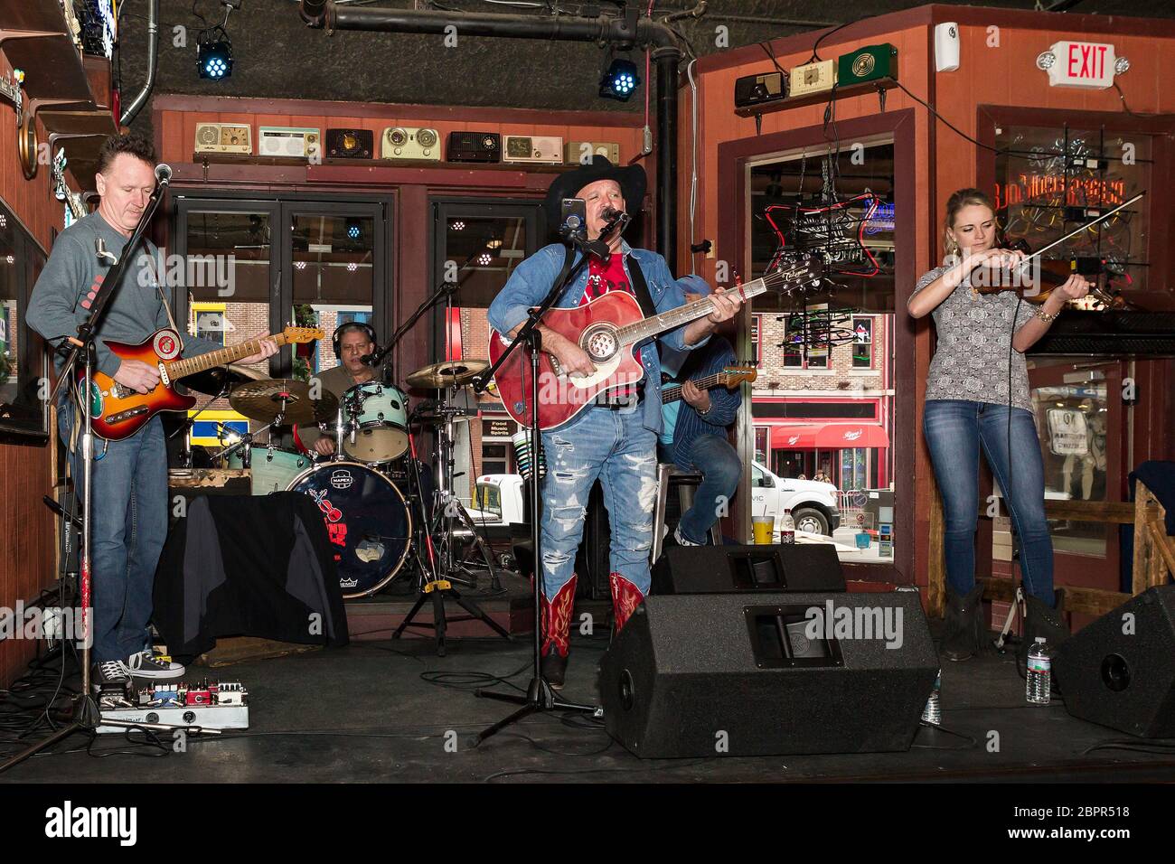 A band plays country music covers at The Second Fiddle in Nashville ...