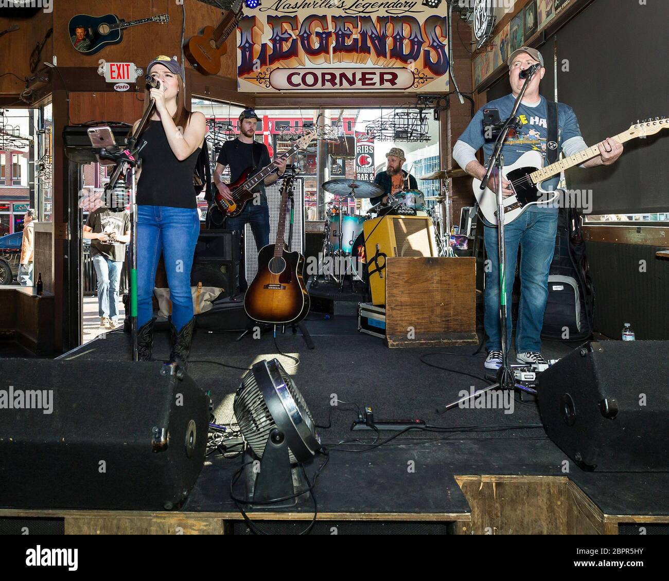 A band plays country music covers at Crossroads in Nashville, Tennessee ...
