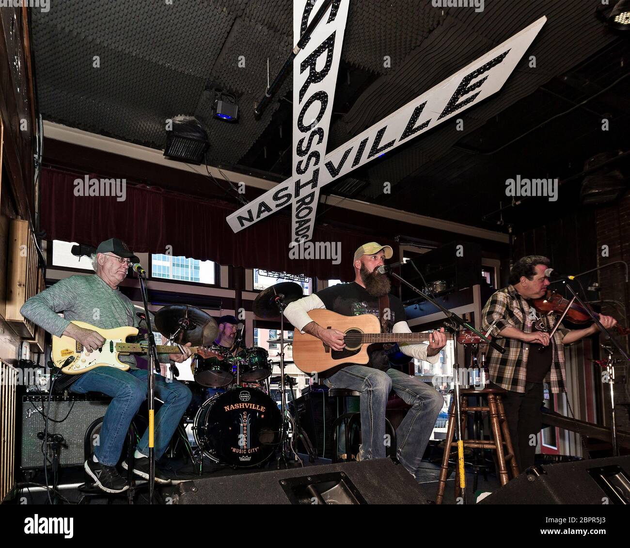 A band plays country music covers at Crossroads in Nashville, Tennessee ...