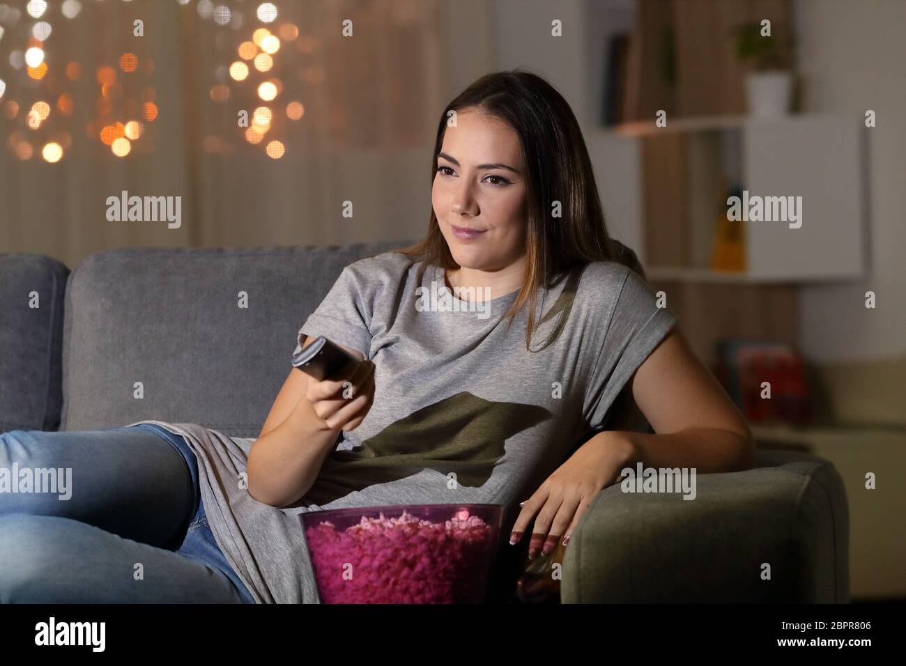 Adult watching tv alone night time hi-res stock photography and images ...