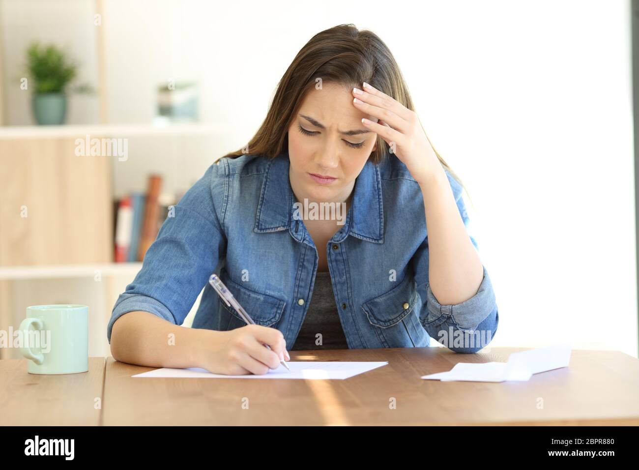 Woman list worried hi-res stock photography and images - Alamy