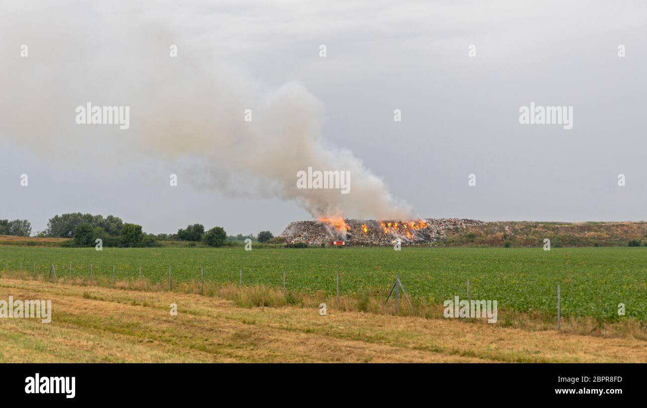 Landfill Garbage Fire Inferno With Heavy Smoke Stock Photo - Alamy
