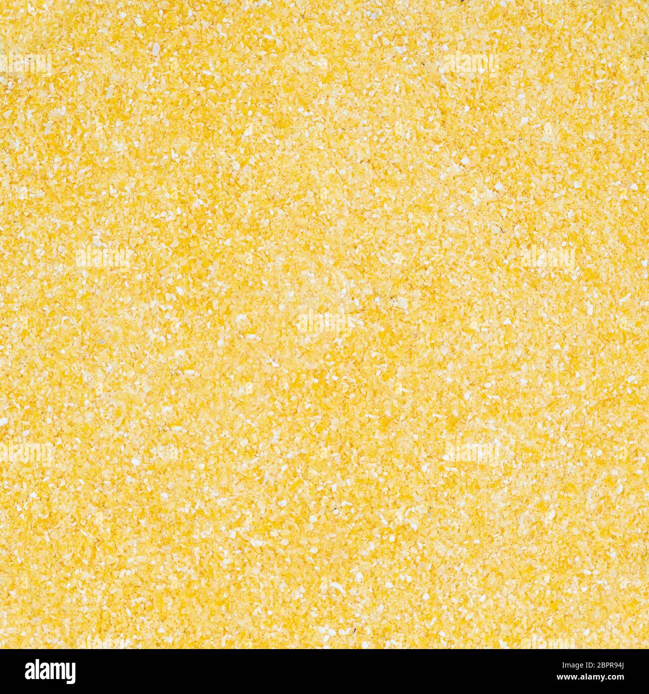 some yellow corn flour as a background Stock Photo - Alamy