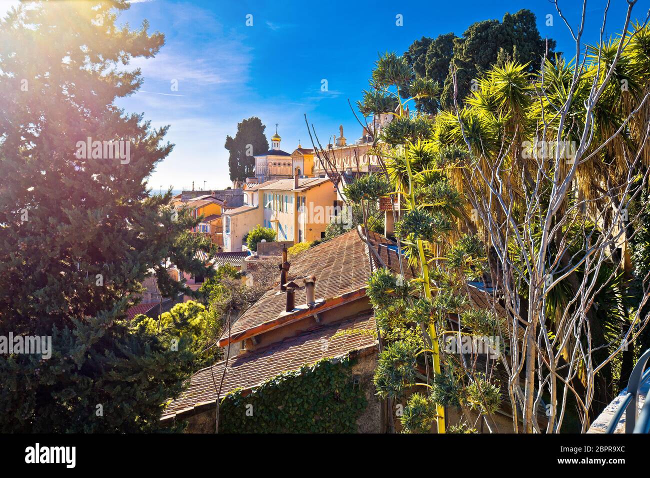 Rooftops and graveyard of Menton sun haze view, town in southern France ...