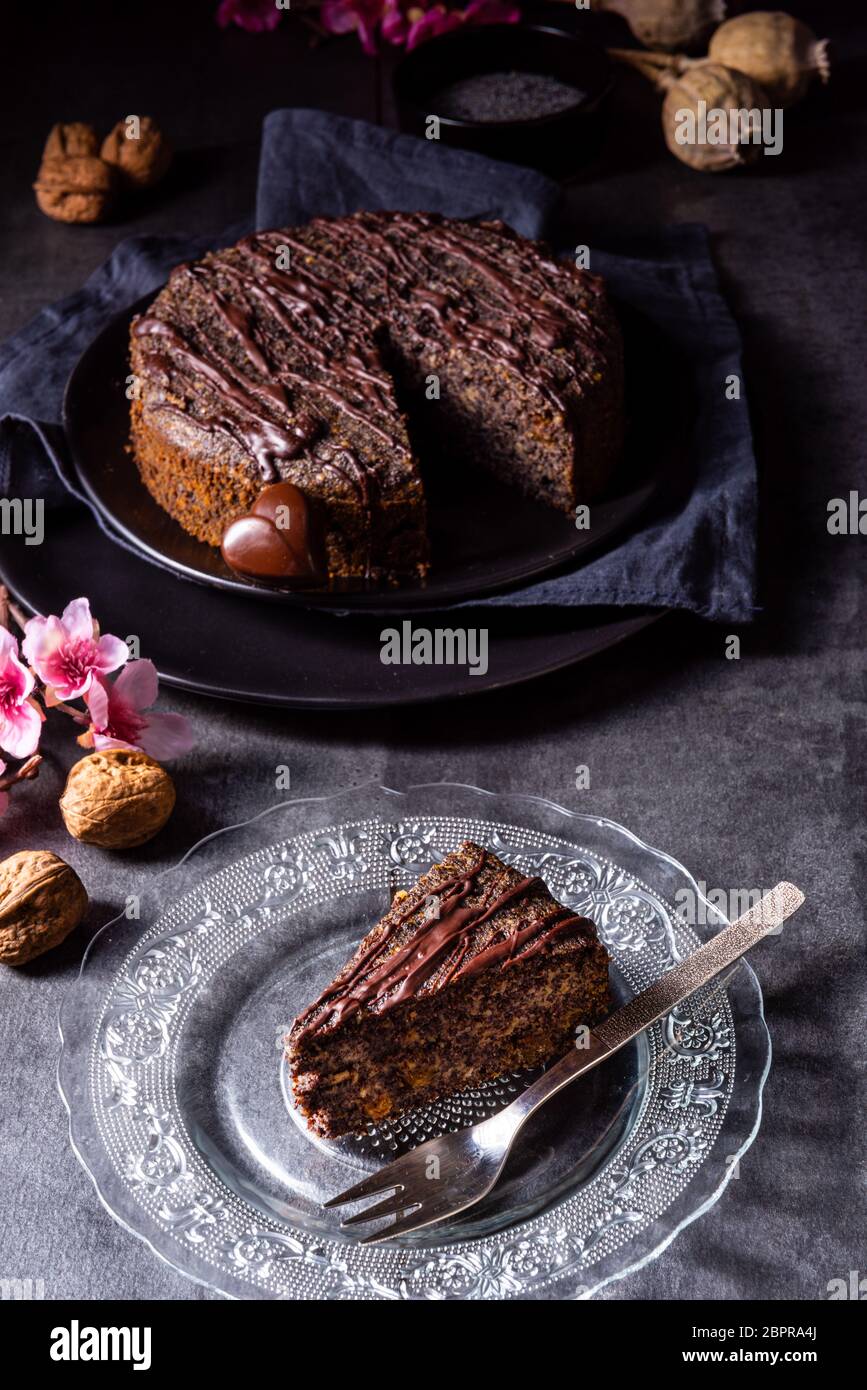 juicy poppy seed cake with apples and chocolate glaze Stock Photo - Alamy