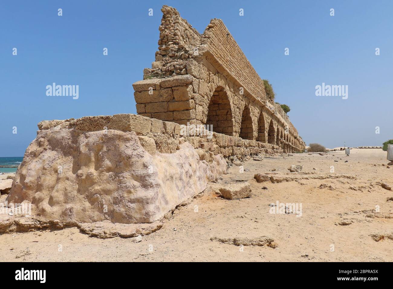 The ruins of the ancient Roman Aqueduct in city of Caesarea Maritima ...