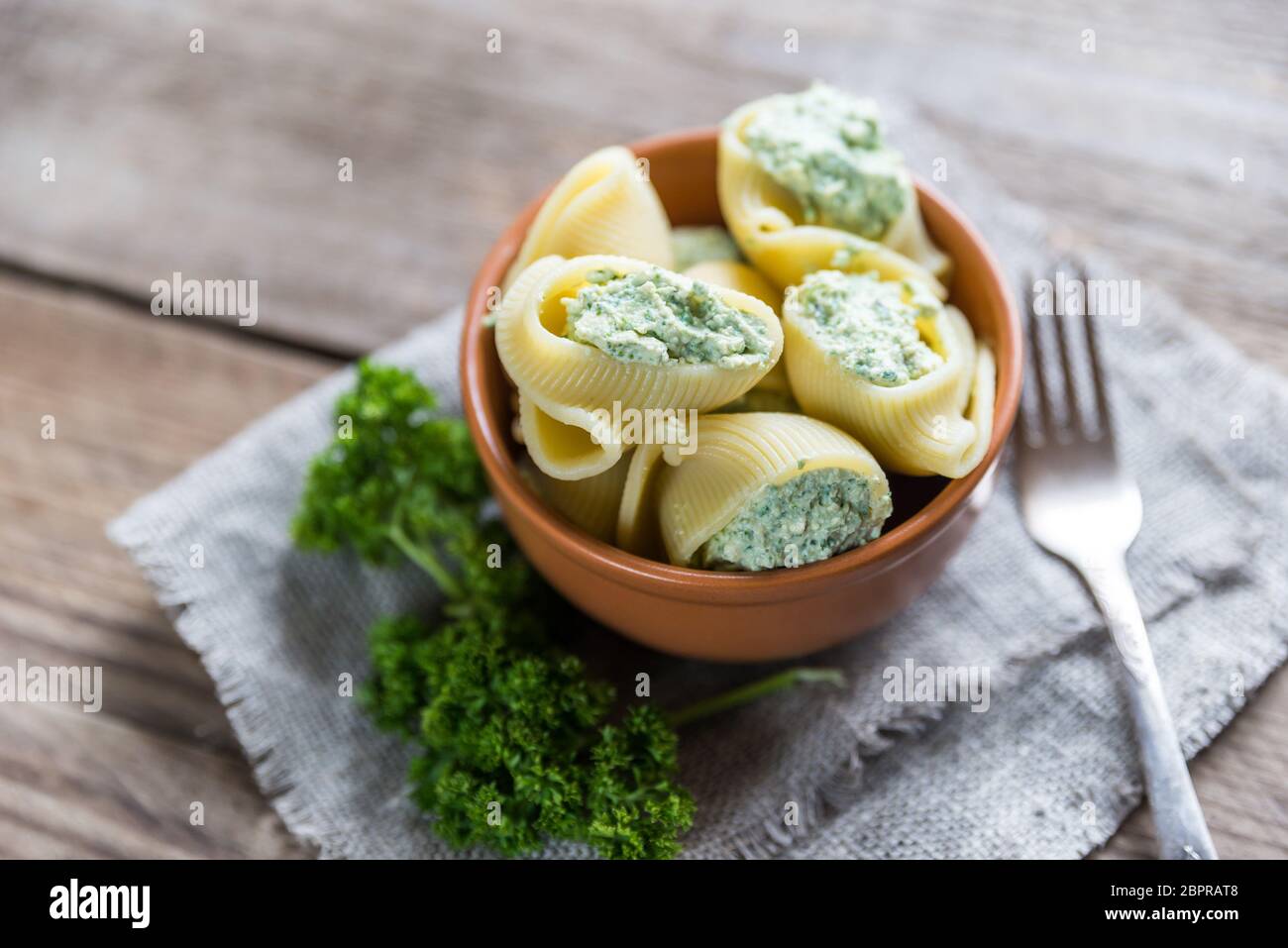 Stuffed lumaconi with cheese Stock Photo - Alamy