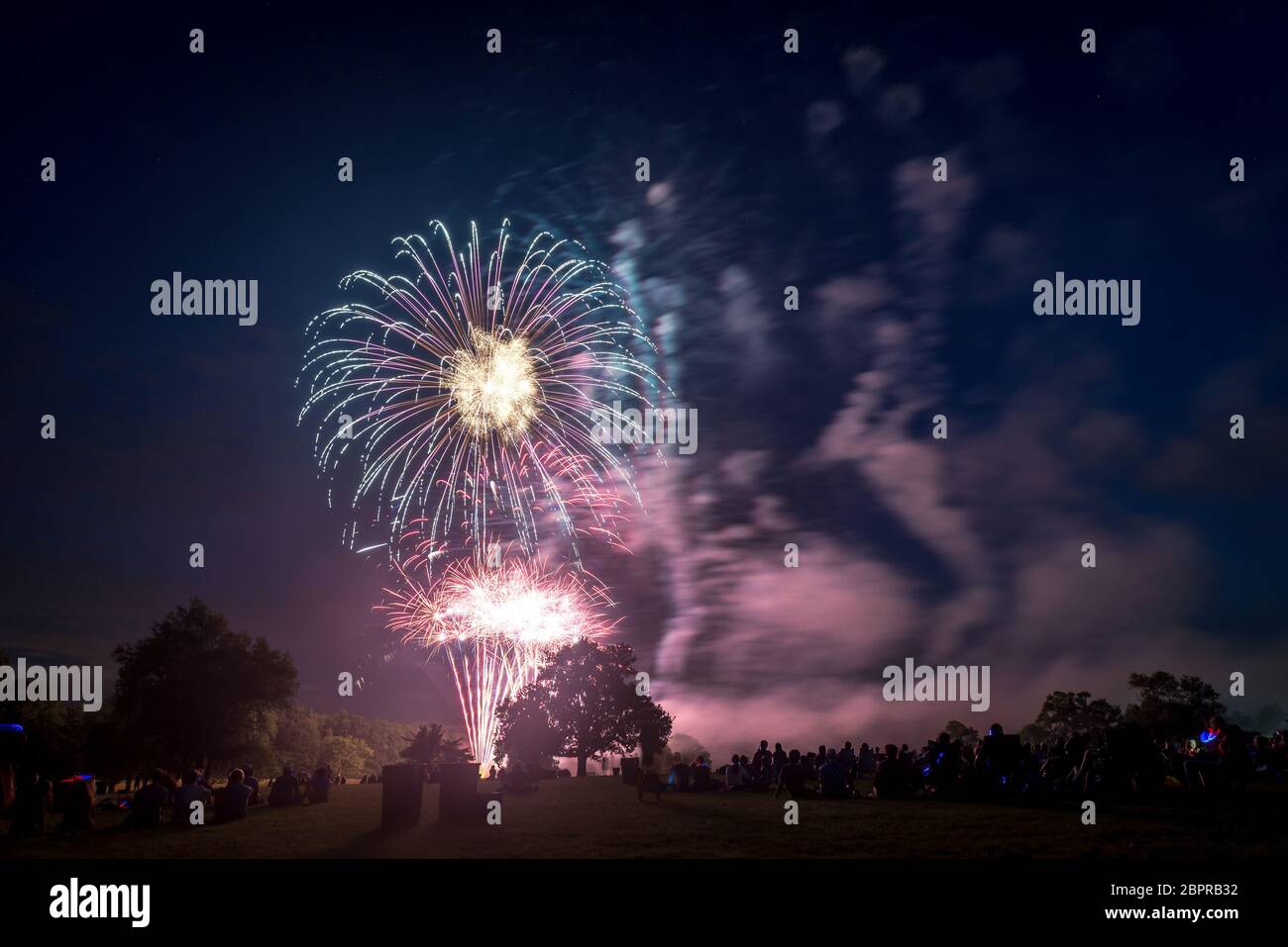 People looking at fireworks in honor of Independence Day Stock Photo ...