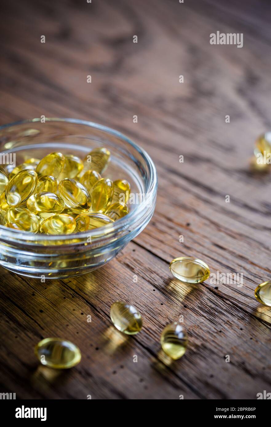 Omega-3 capsules under the glass dome Stock Photo - Alamy