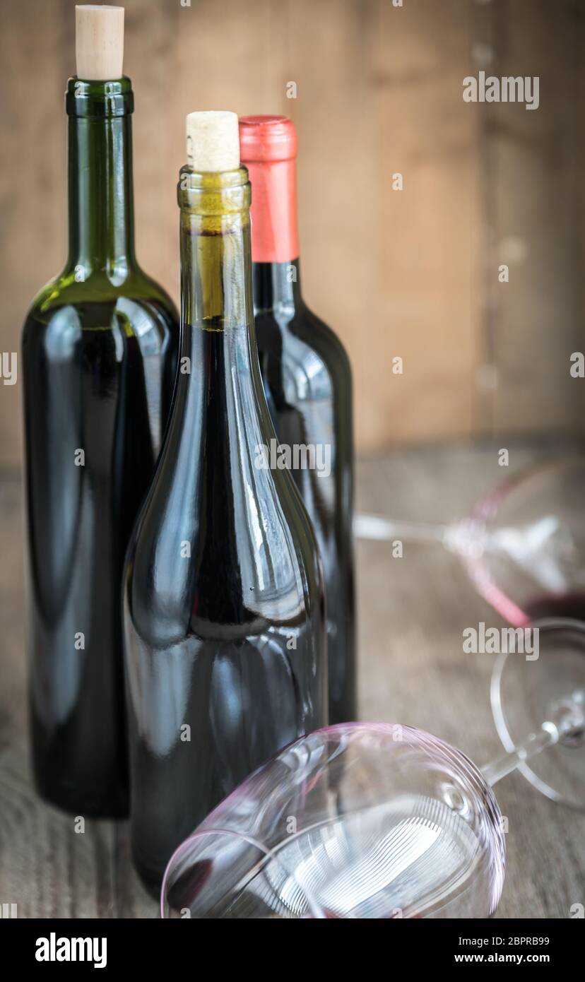 Bottles with red wine Stock Photo - Alamy