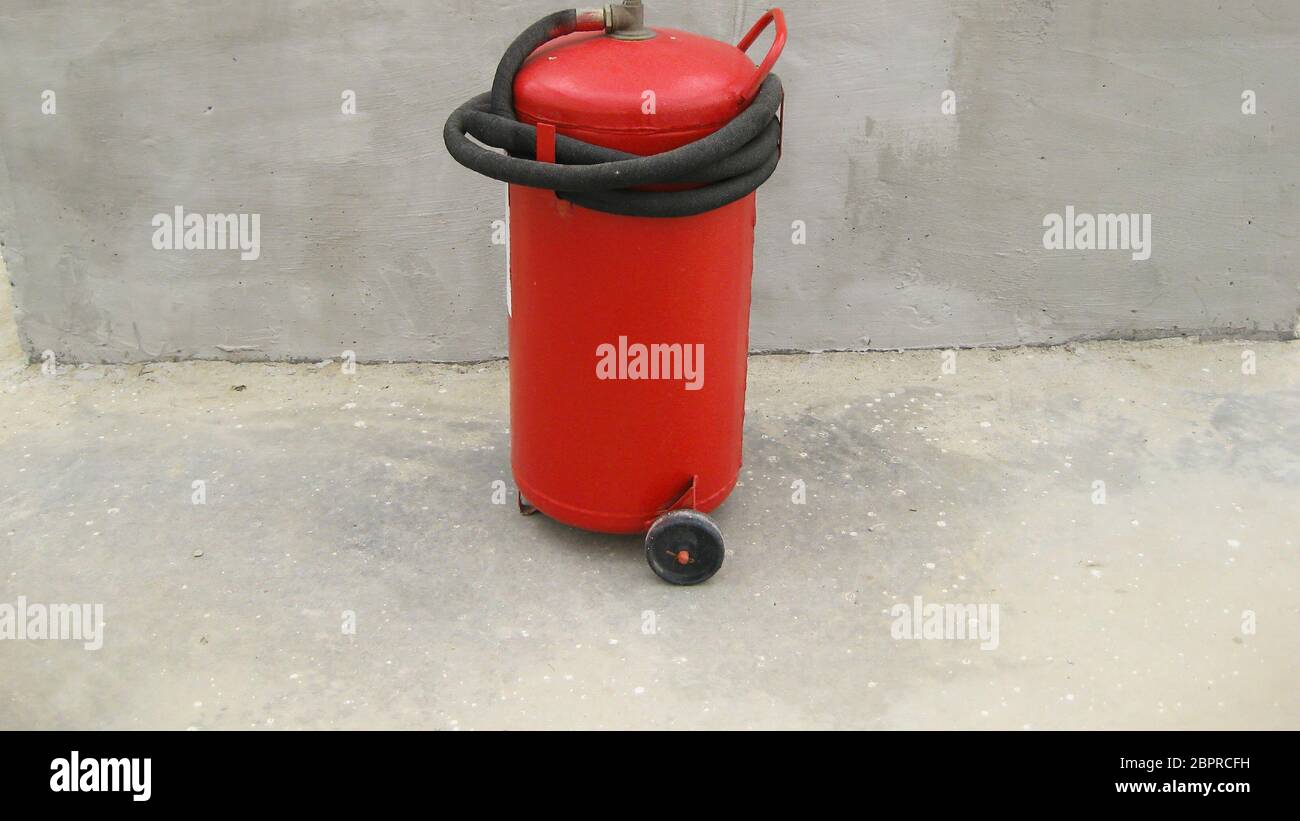 Fire extinguisher. Equipment for primary oil refining Stock Photo - Alamy