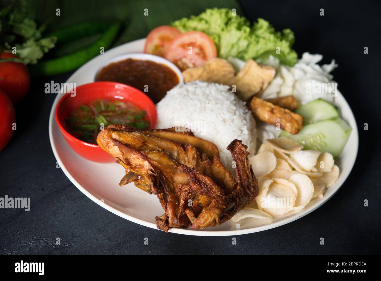 Nasi lemak kukus with fried chicken, popular traditional Malaysian ...