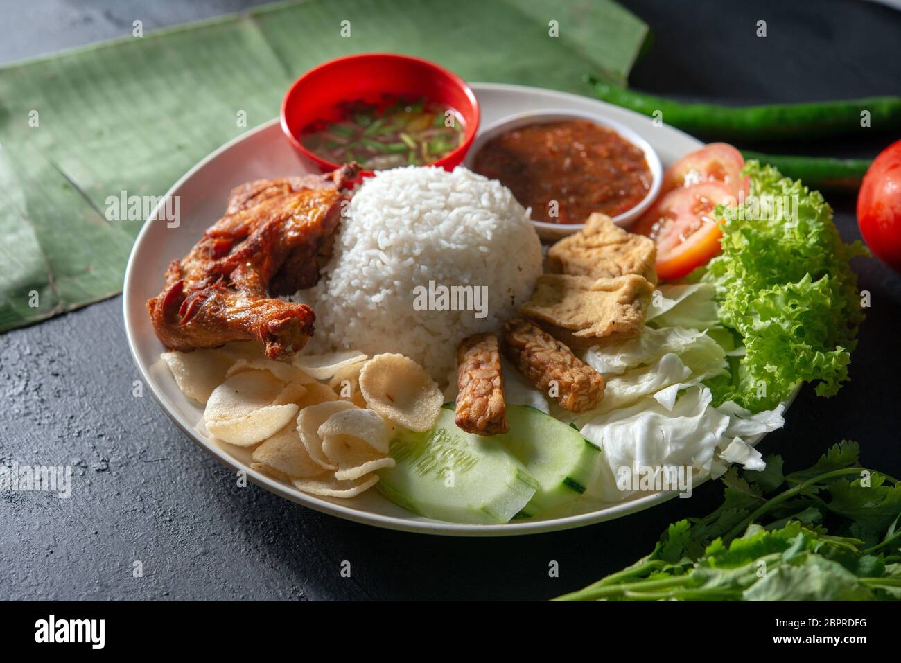 Nasi lemak kukus with fried drumstick, popular traditional Malaysian ...