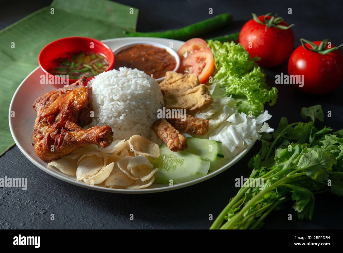 Nasi lemak kukus with fried drumstick, popular traditional Malaysian ...