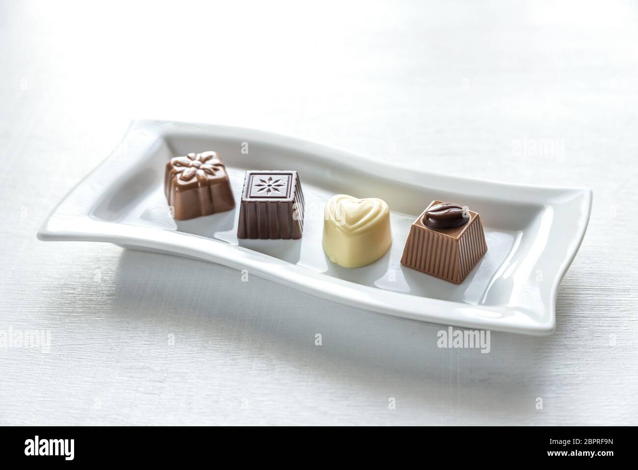 Chocolate candies of different shapes Stock Photo - Alamy