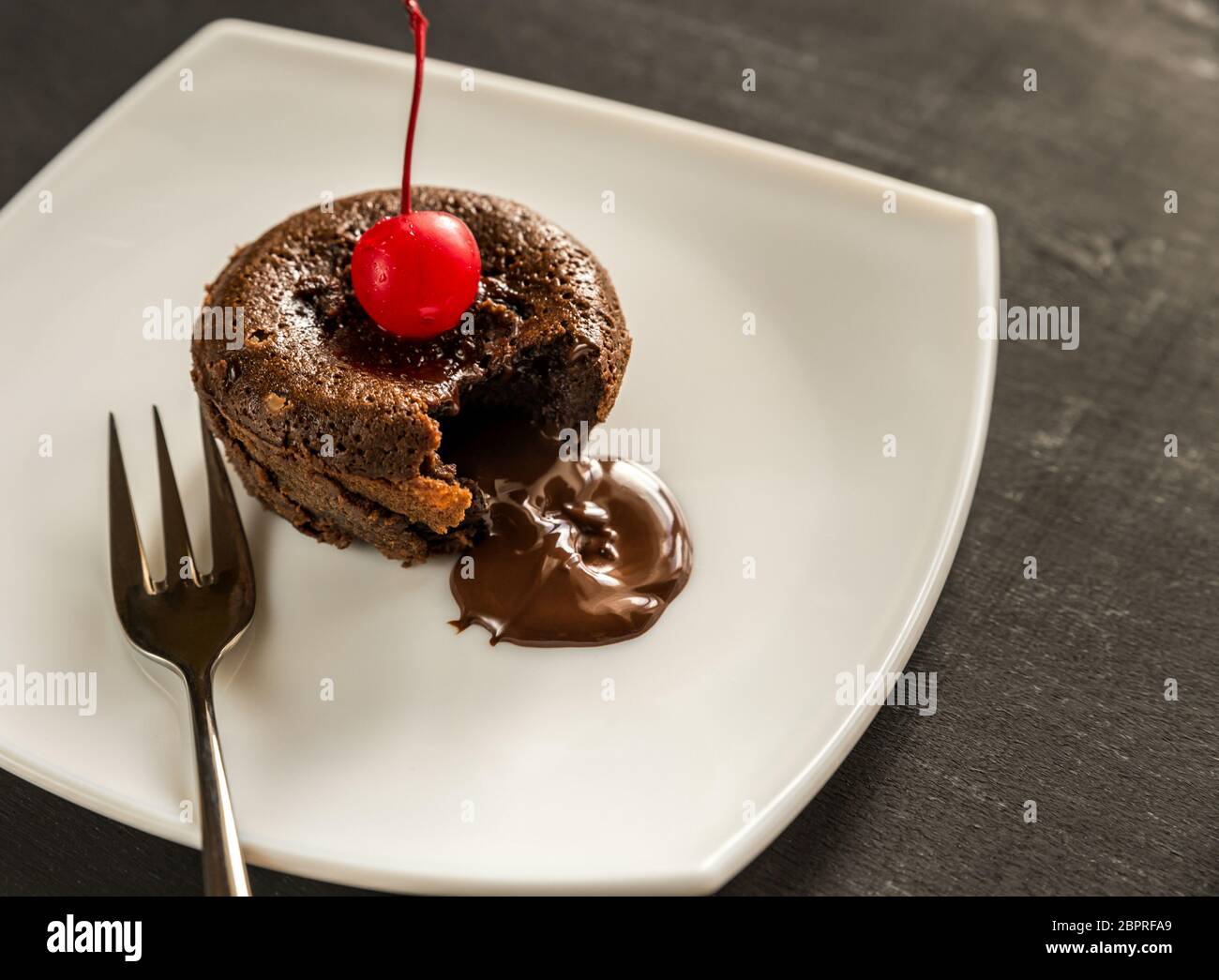 Fondant decorated with cocktail cherry Stock Photo - Alamy
