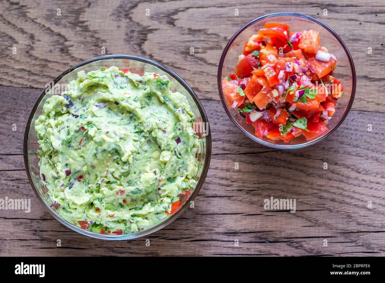 Bowls of guacamole and salsa Stock Photo - Alamy