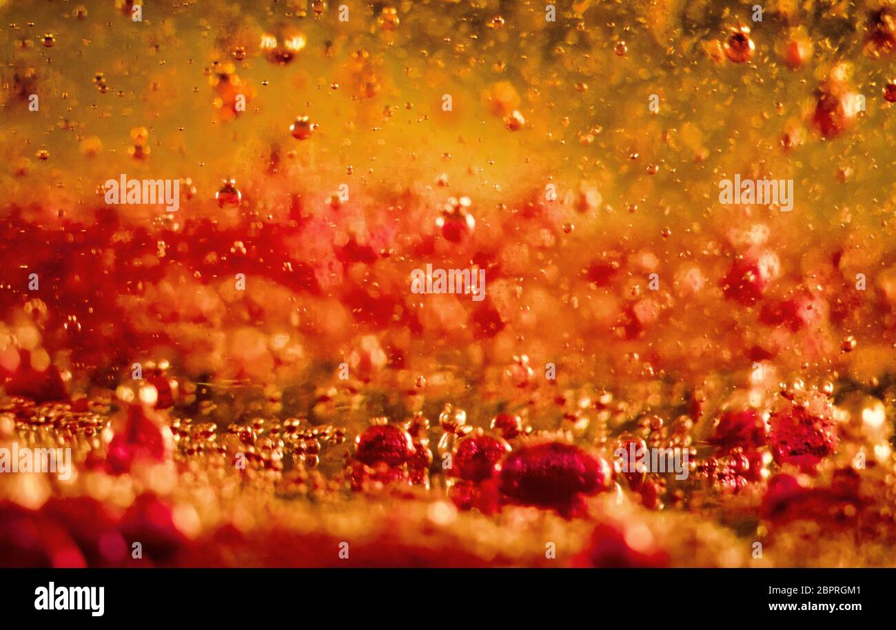 Colorful bubbly liquid in with unique shapes and pattern. Artistic ...