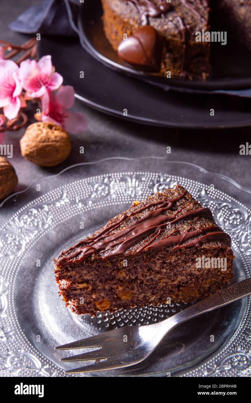 juicy poppy seed cake with apples and chocolate glaze Stock Photo - Alamy