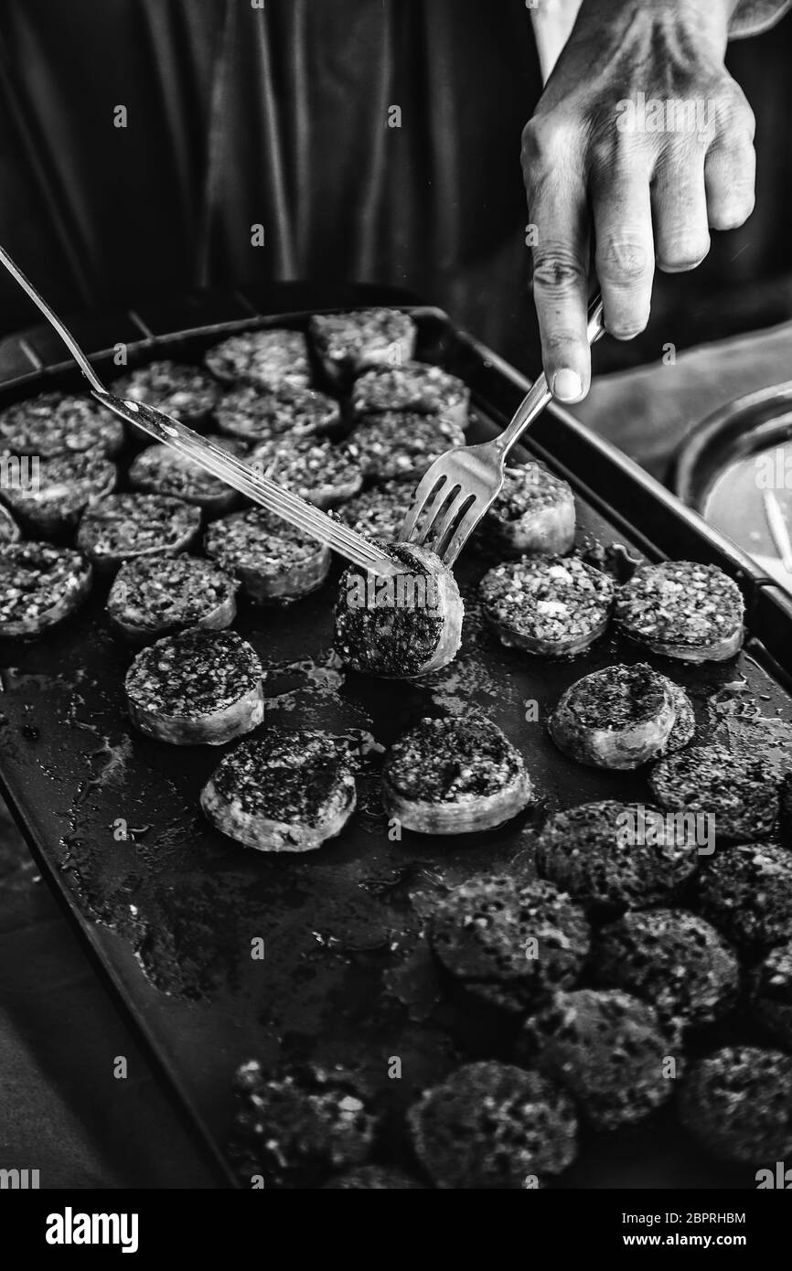 Man cooking fire in Black and White Stock Photos & Images - Alamy