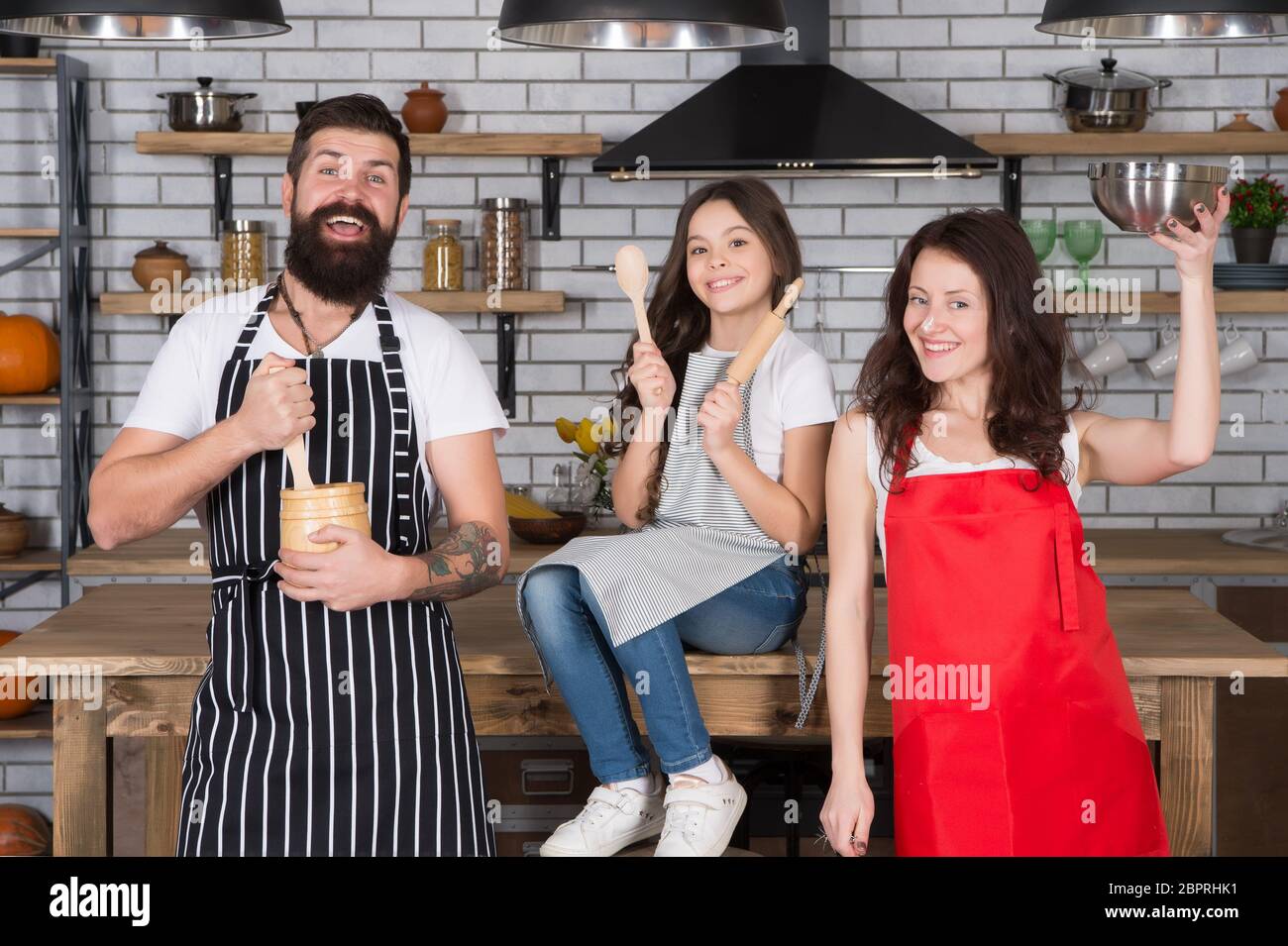 Prepare birthday cake. Friendly family. Mother father and daughter ...