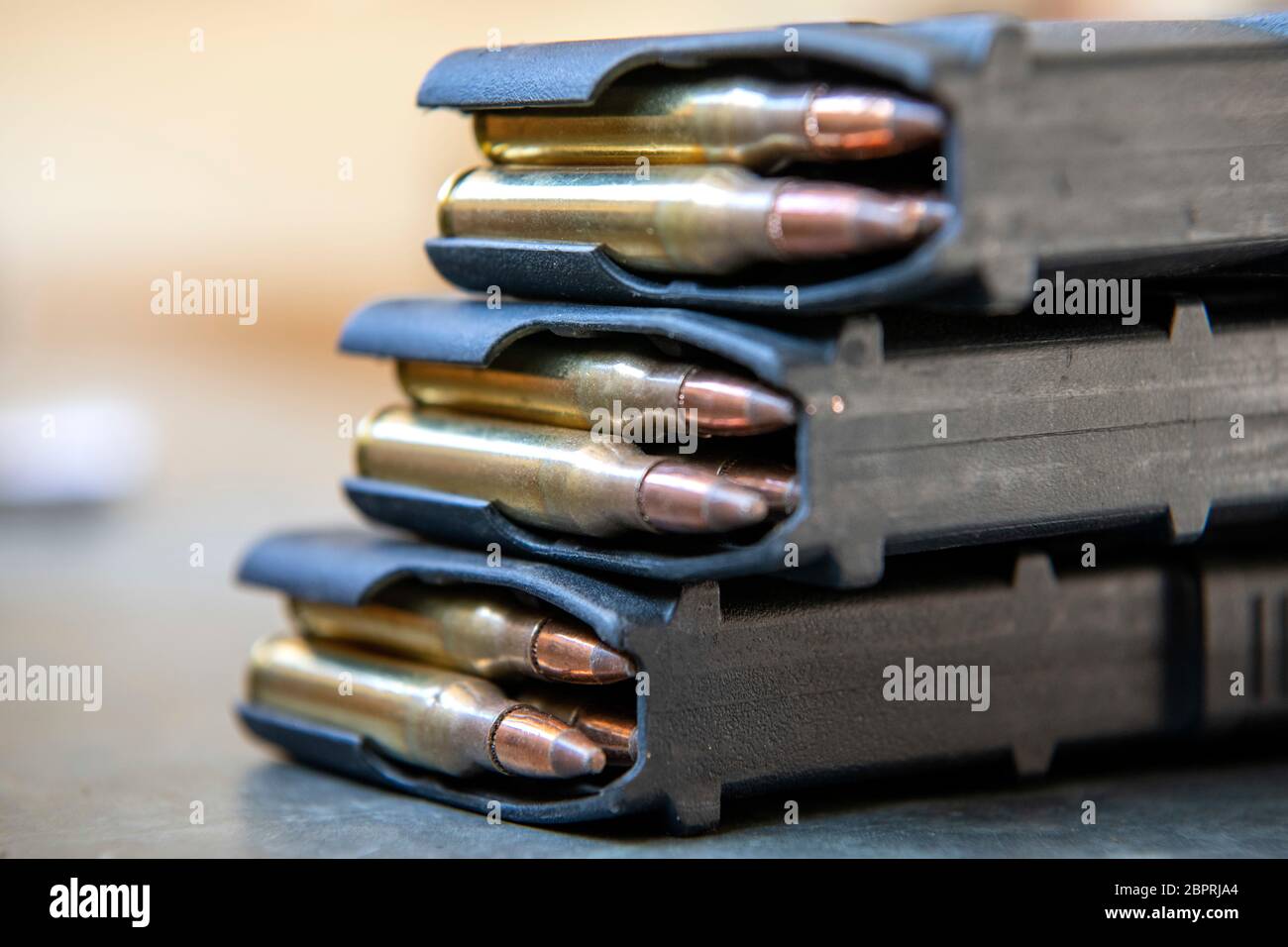 Three magazines laden with M4 carbine rounds on a table at the 60th ...