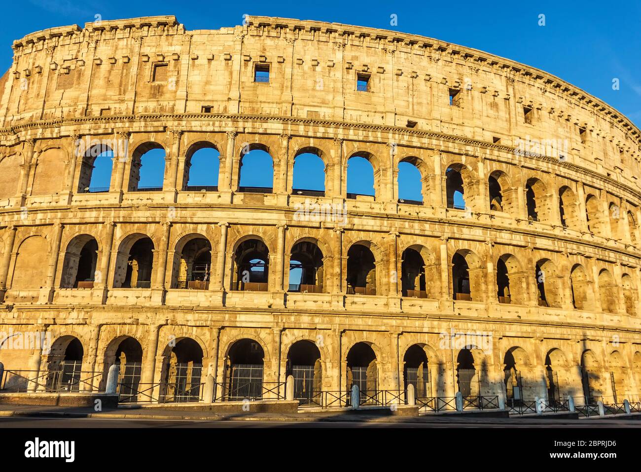 The Colosseum of Rome under the blue summer sky Stock Photo - Alamy