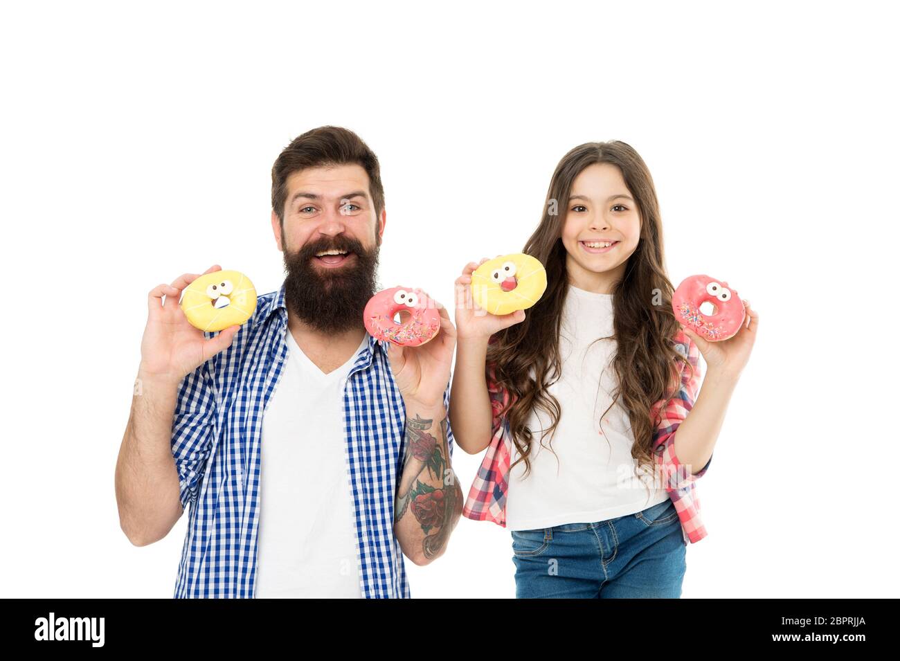 Come taste the paradise. Happy family hold funny donuts. Enjoying food ...