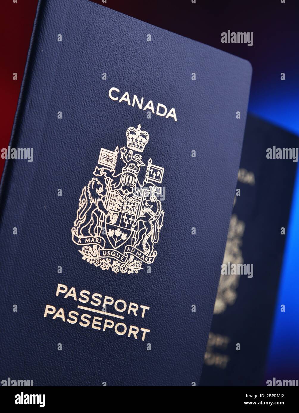 Composition with two Canadian passports Stock Photo - Alamy