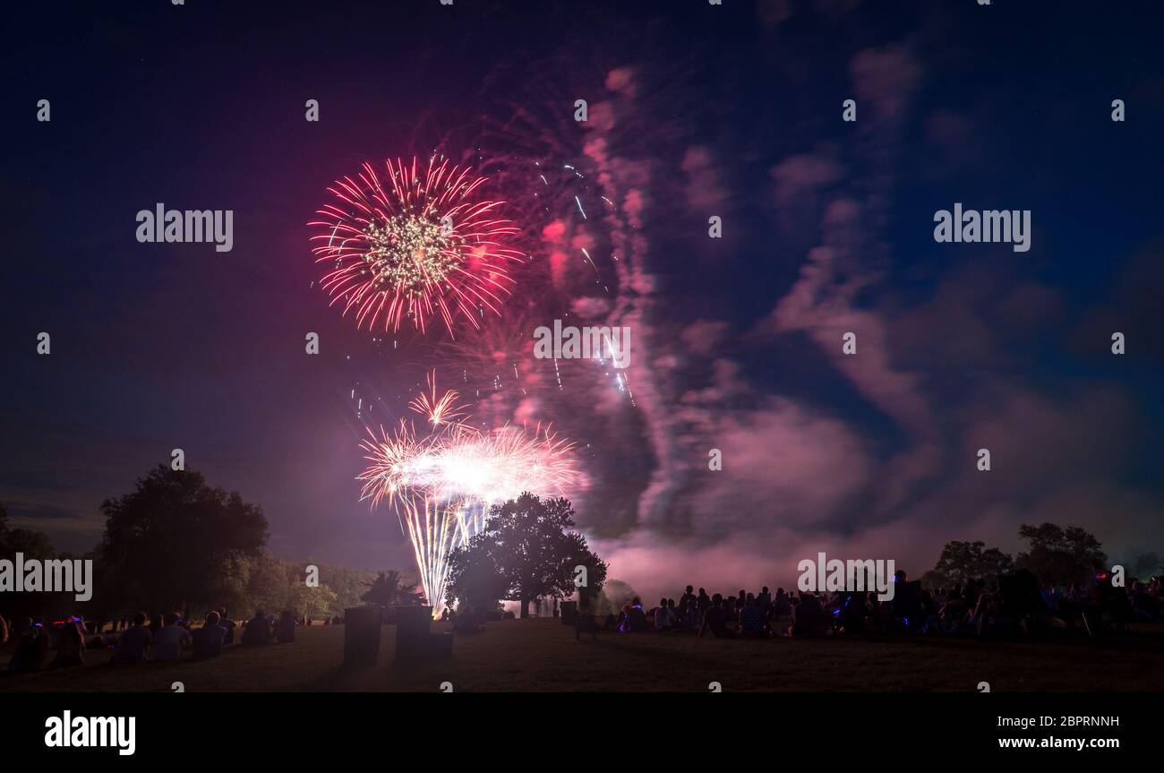 People looking at fireworks in honor of Independence Day Stock Photo ...