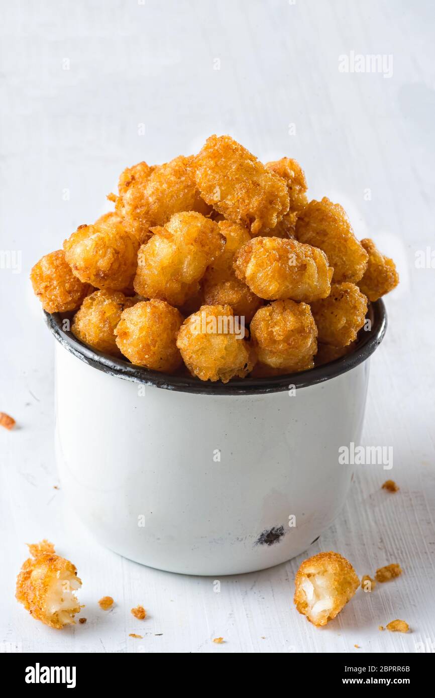 close up of rustic fried golden potato tater tots Stock Photo - Alamy