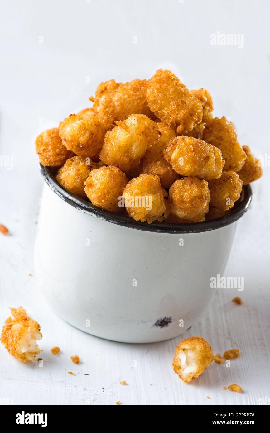 close up of rustic fried golden potato tater tots Stock Photo - Alamy