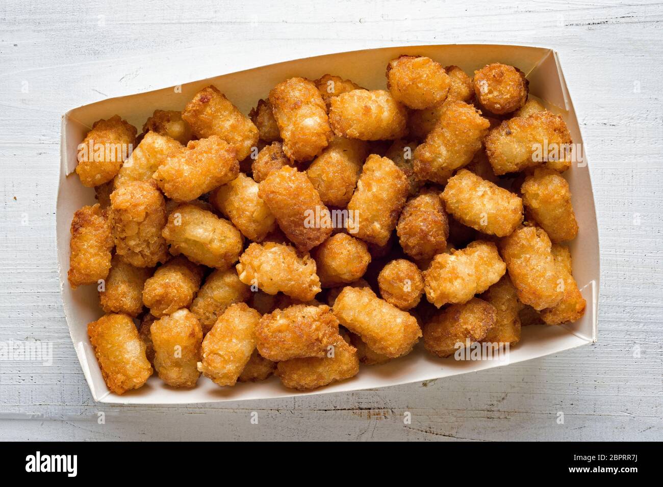 close up of rustic fried golden potato tater tots Stock Photo - Alamy