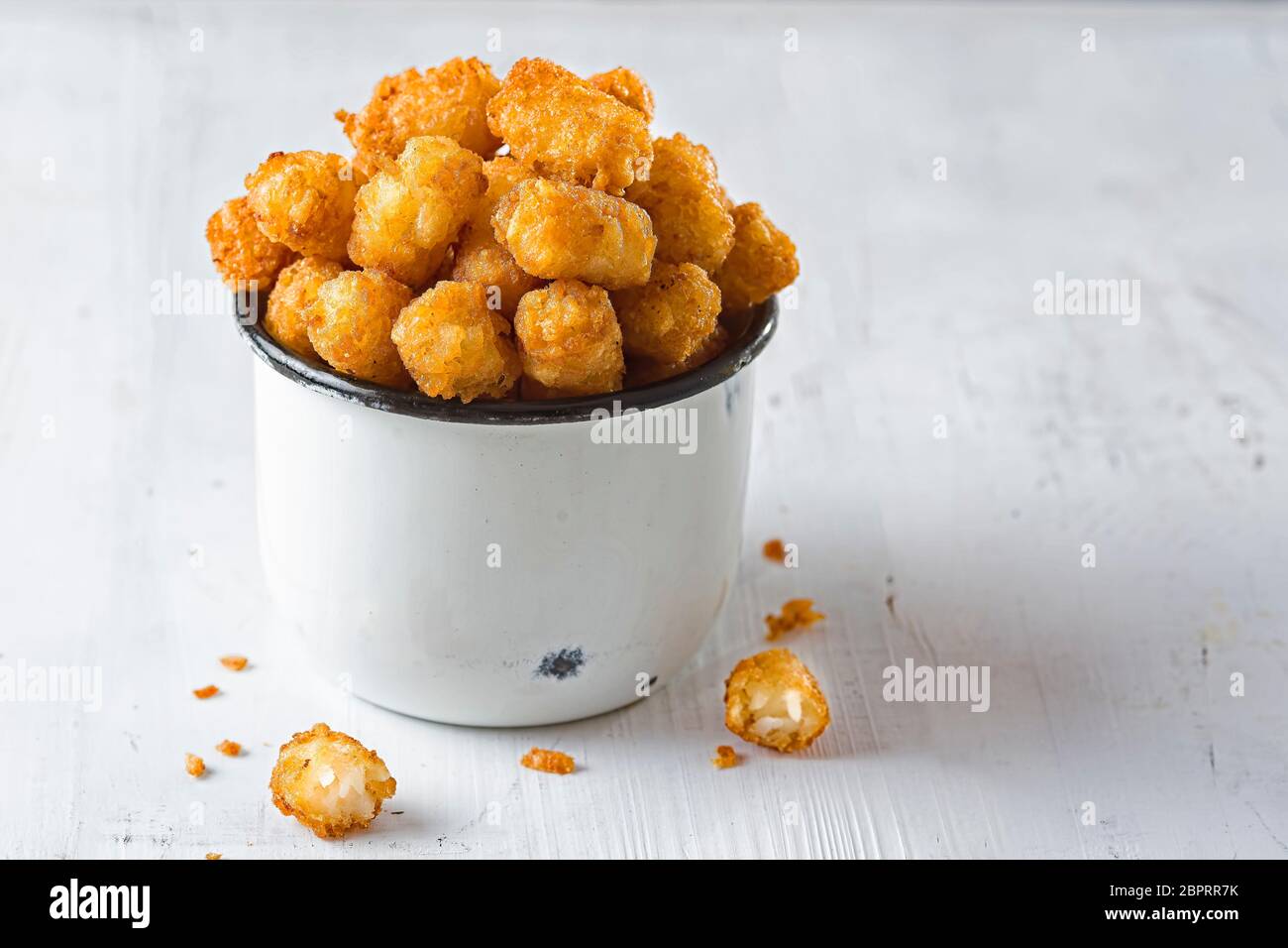 close up of rustic fried golden potato tater tots Stock Photo - Alamy
