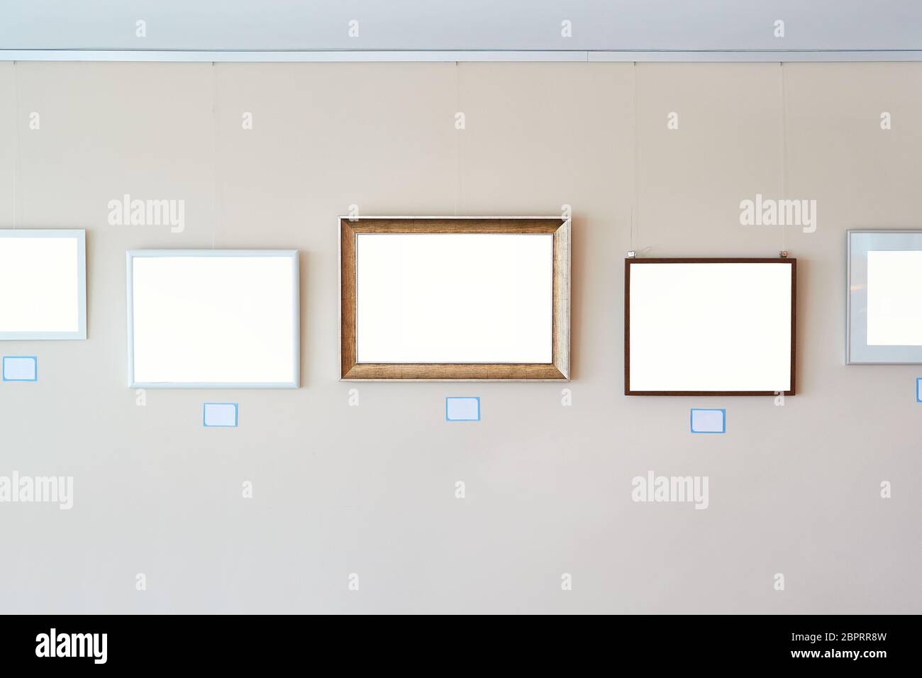 Empty picture frames on a gallery wall Stock Photo - Alamy