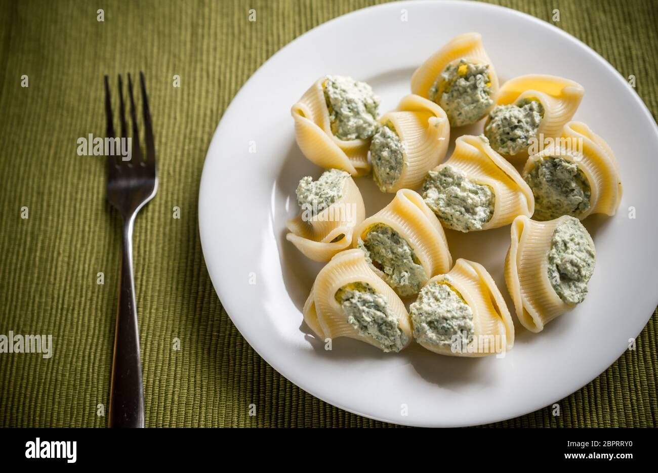 Stuffed lumaconi with cheese Stock Photo - Alamy