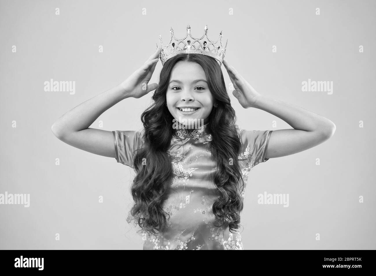 pageant queen. happy kid chinese dress wear crown. portrait of pride ...