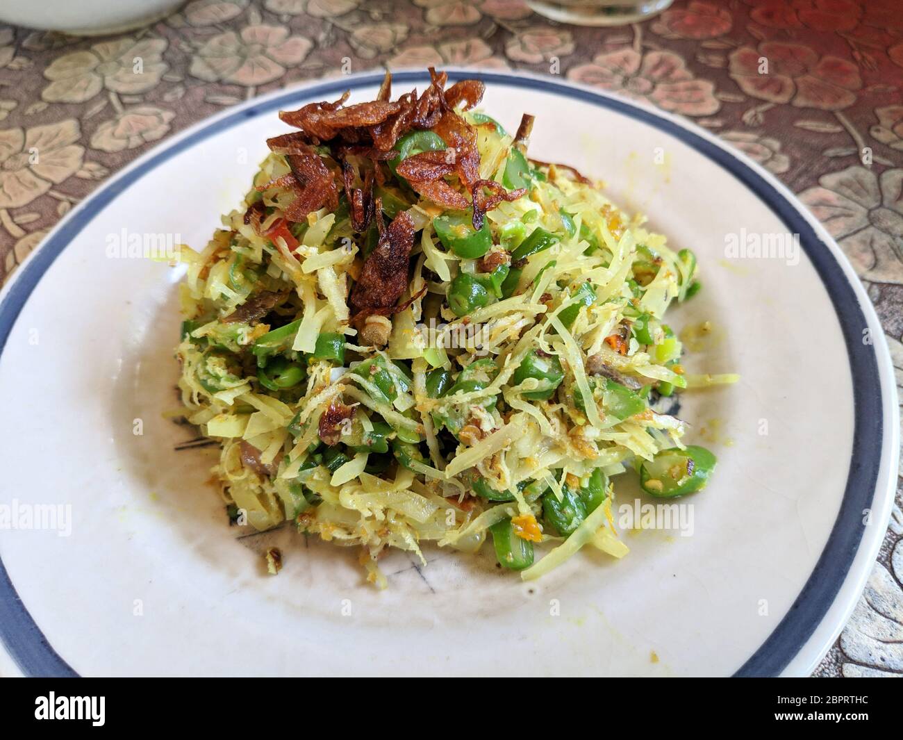 Lawar, a traditional dish from Bali. Green bean salad with chicken ...