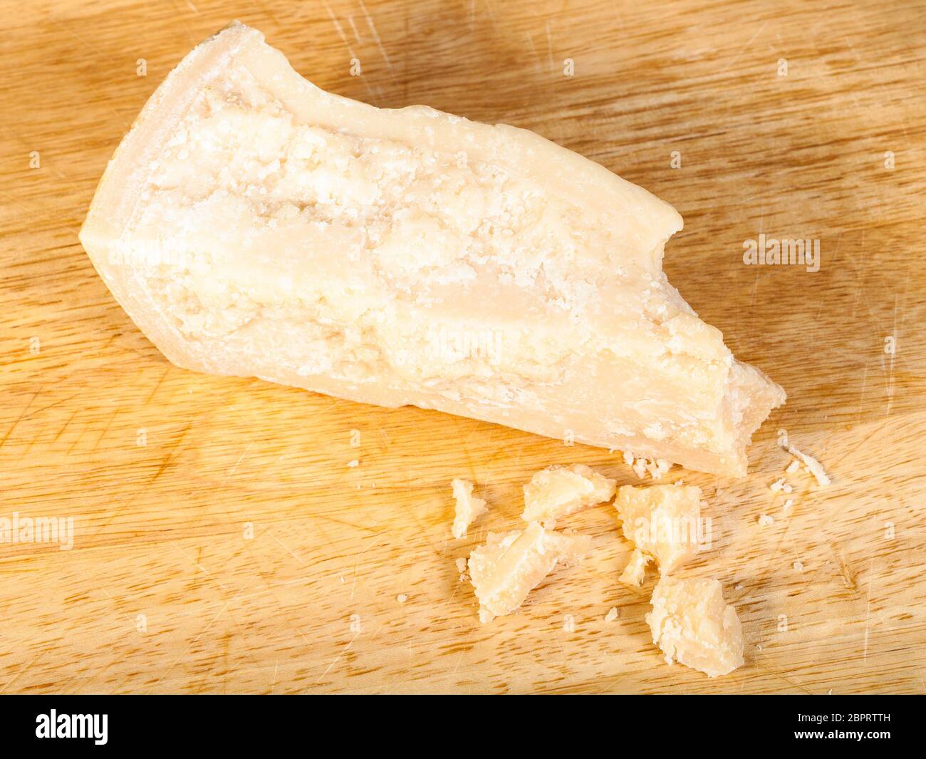 piece of local italian Parmigiano Reggiano (Parmesan) hard cheese with ...