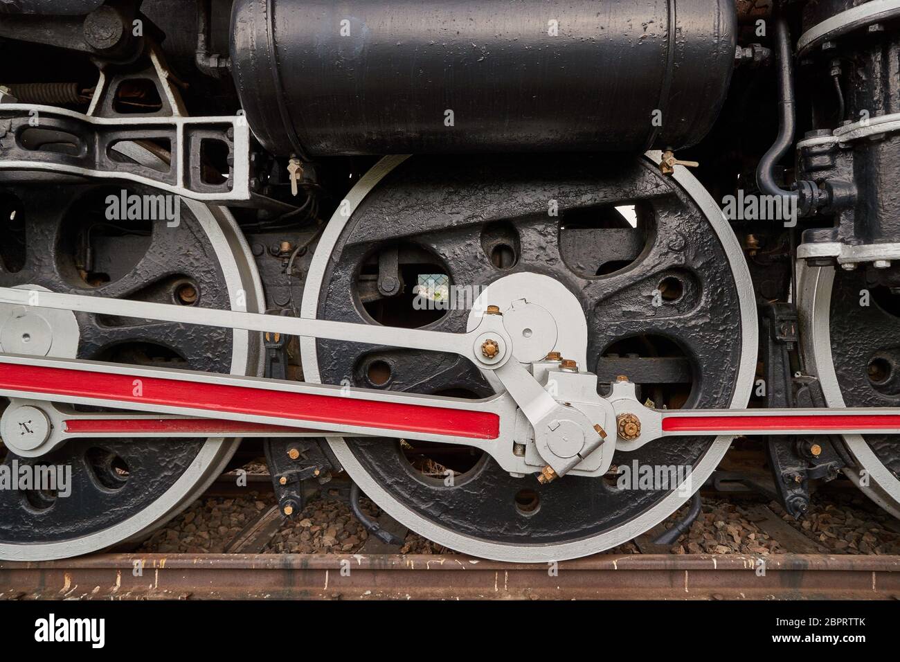 Steam locomotive wheels and cranks closeup Stock Photo - Alamy