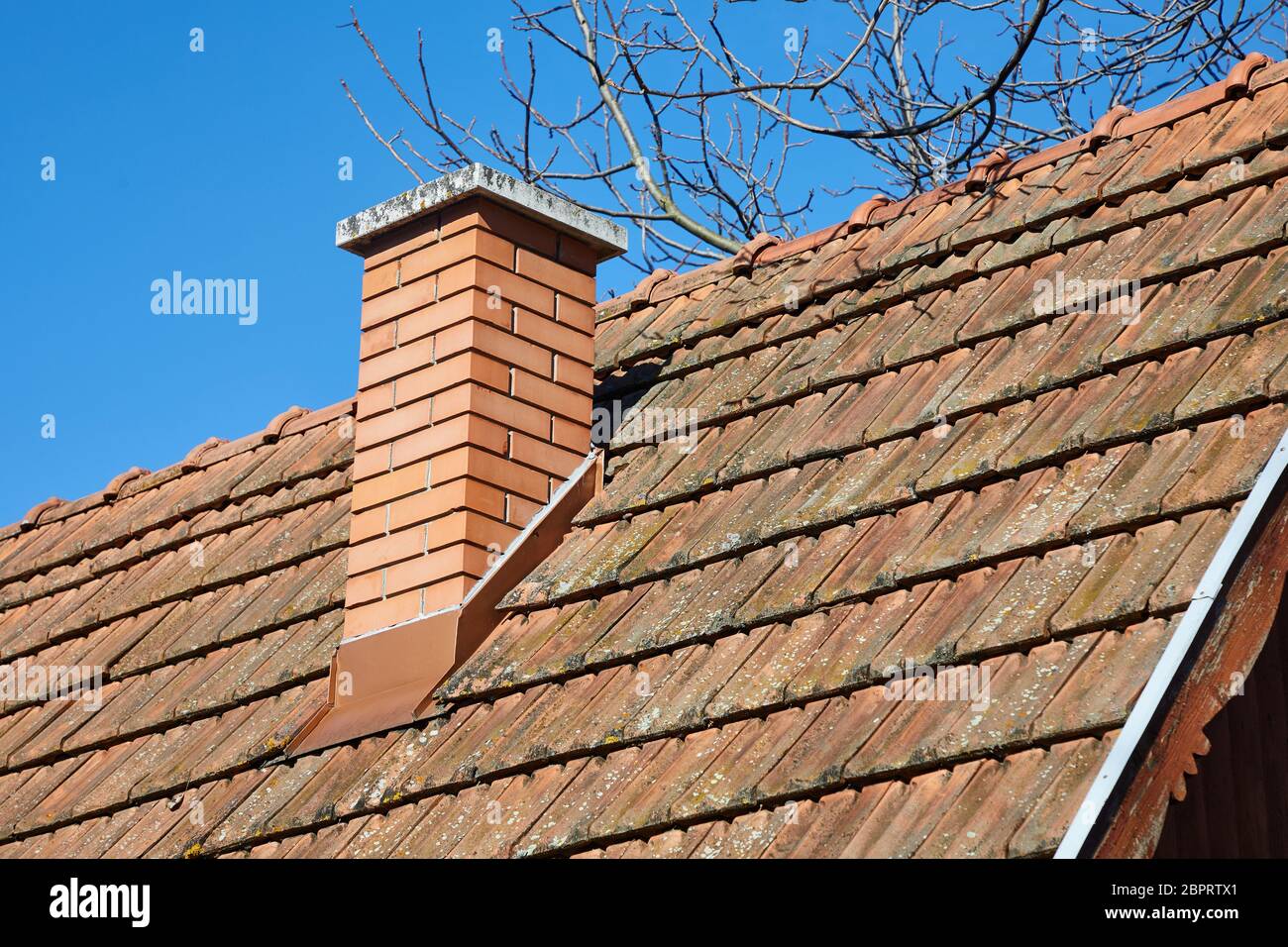 Chimney on a roof of a house Stock Photo - Alamy