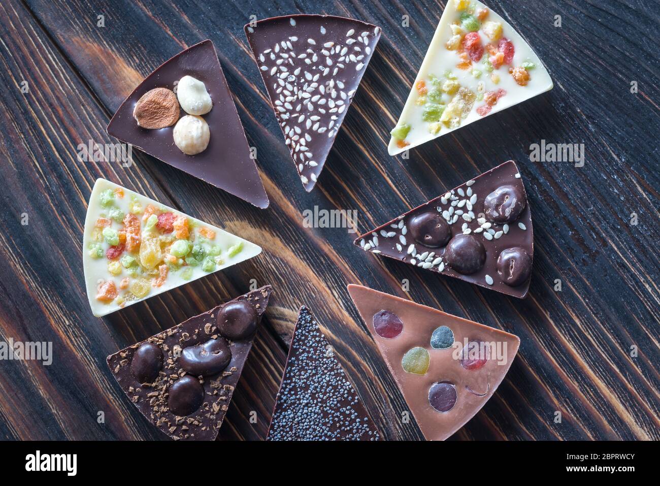 Chocolate candies with different toppings Stock Photo - Alamy