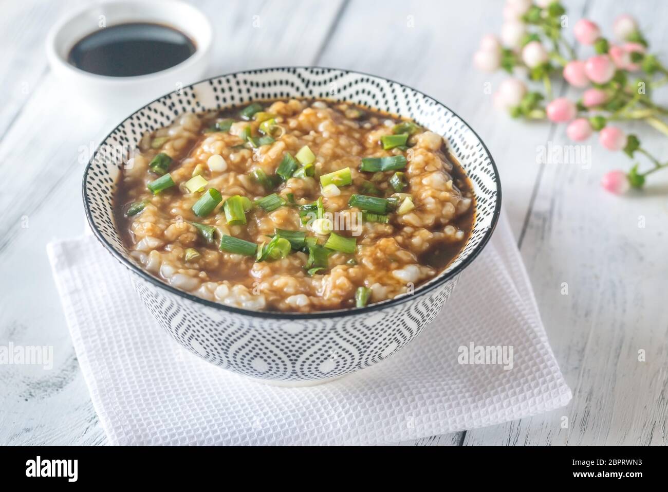 Bowl of congee - Asian rice porridge Stock Photo - Alamy