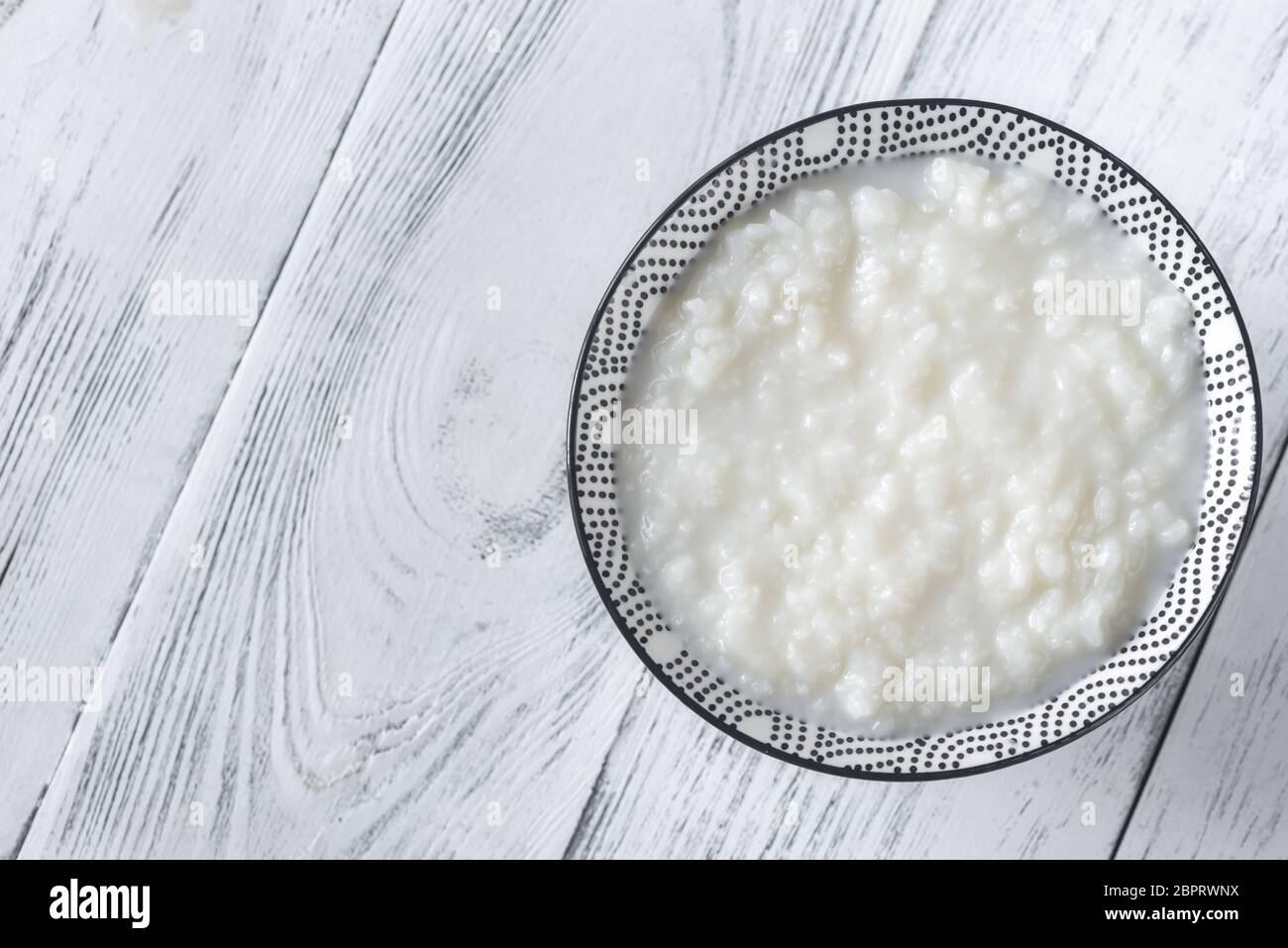 Bowl of congee - Asian rice porridge Stock Photo - Alamy
